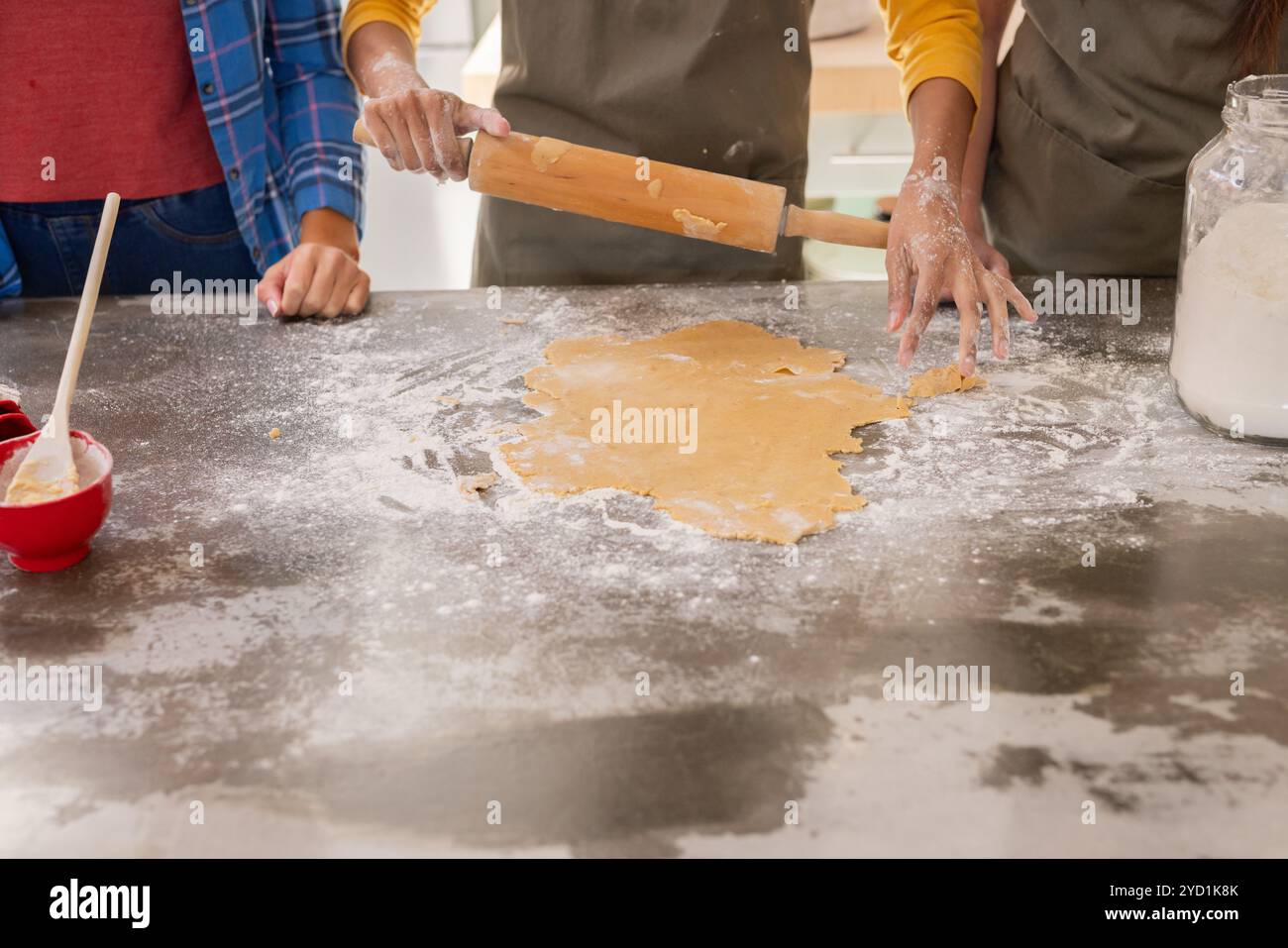 Christmas time, baking cookies, multiracial female friends, at home ...
