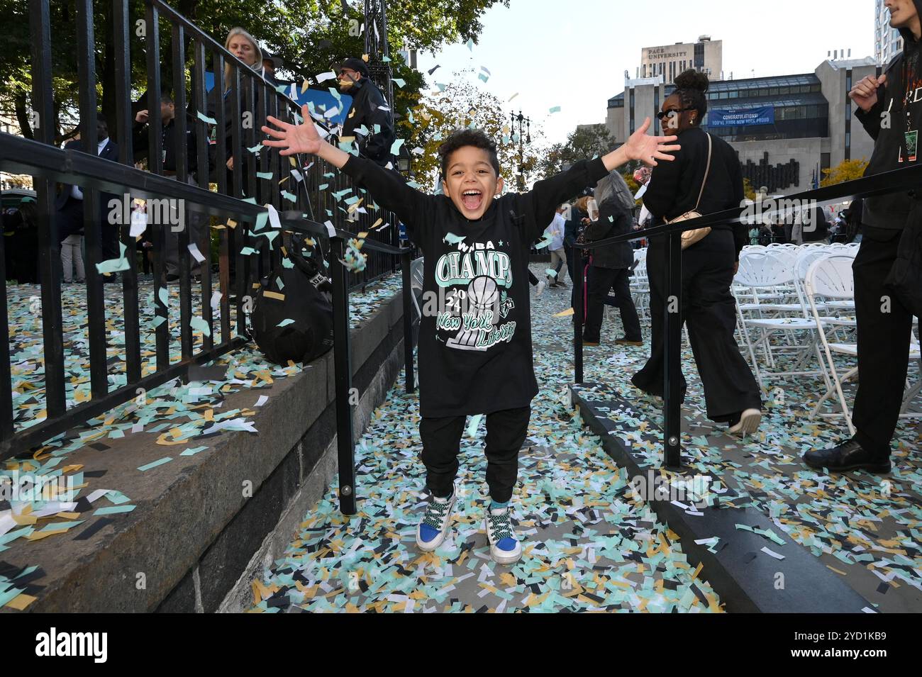 New York, USA. 24th Oct, 2024. Five year-old Kobe, throws confetti in ...