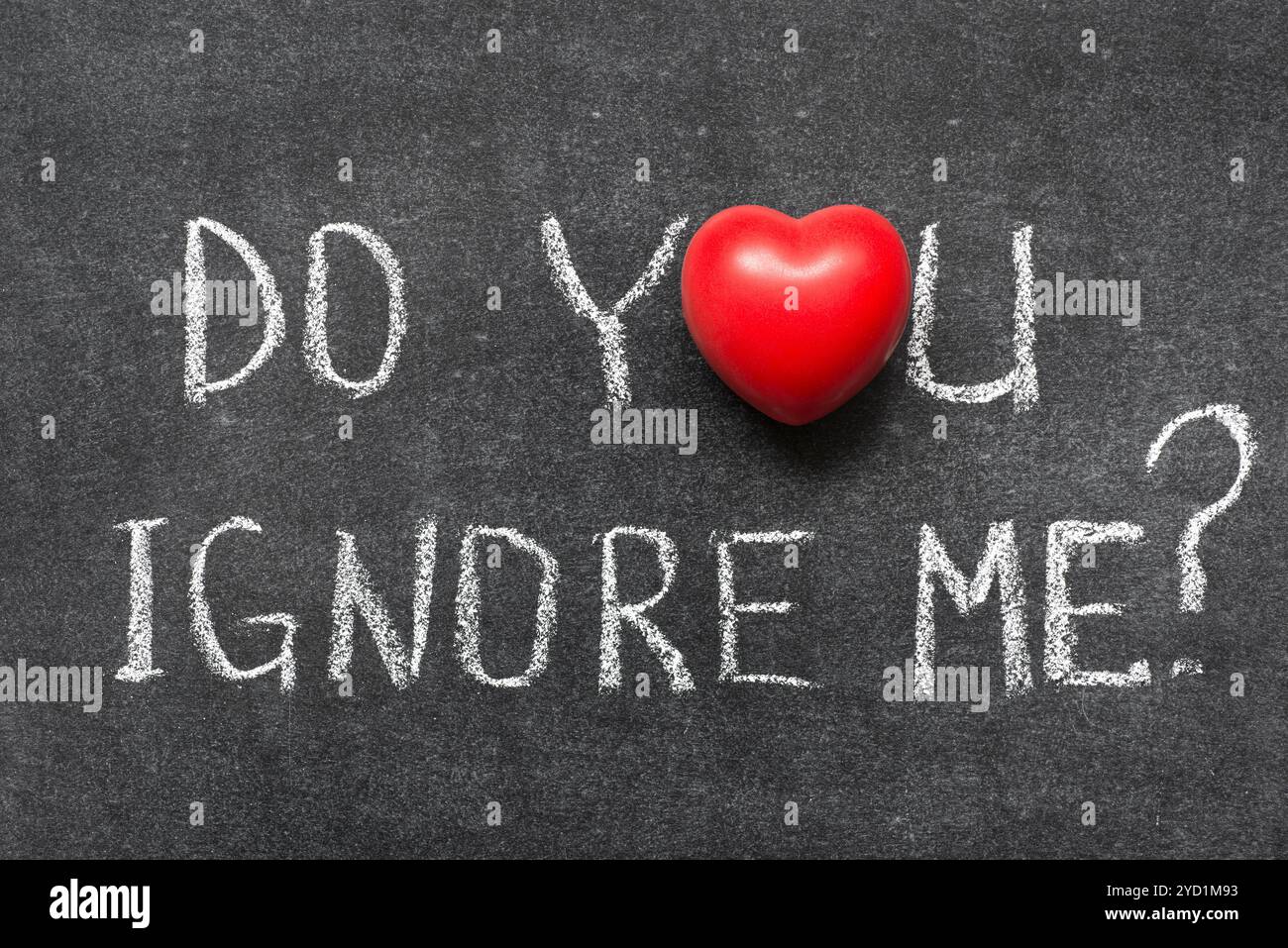 do you ignore me question handwritten on blackboard with heart symbol ...