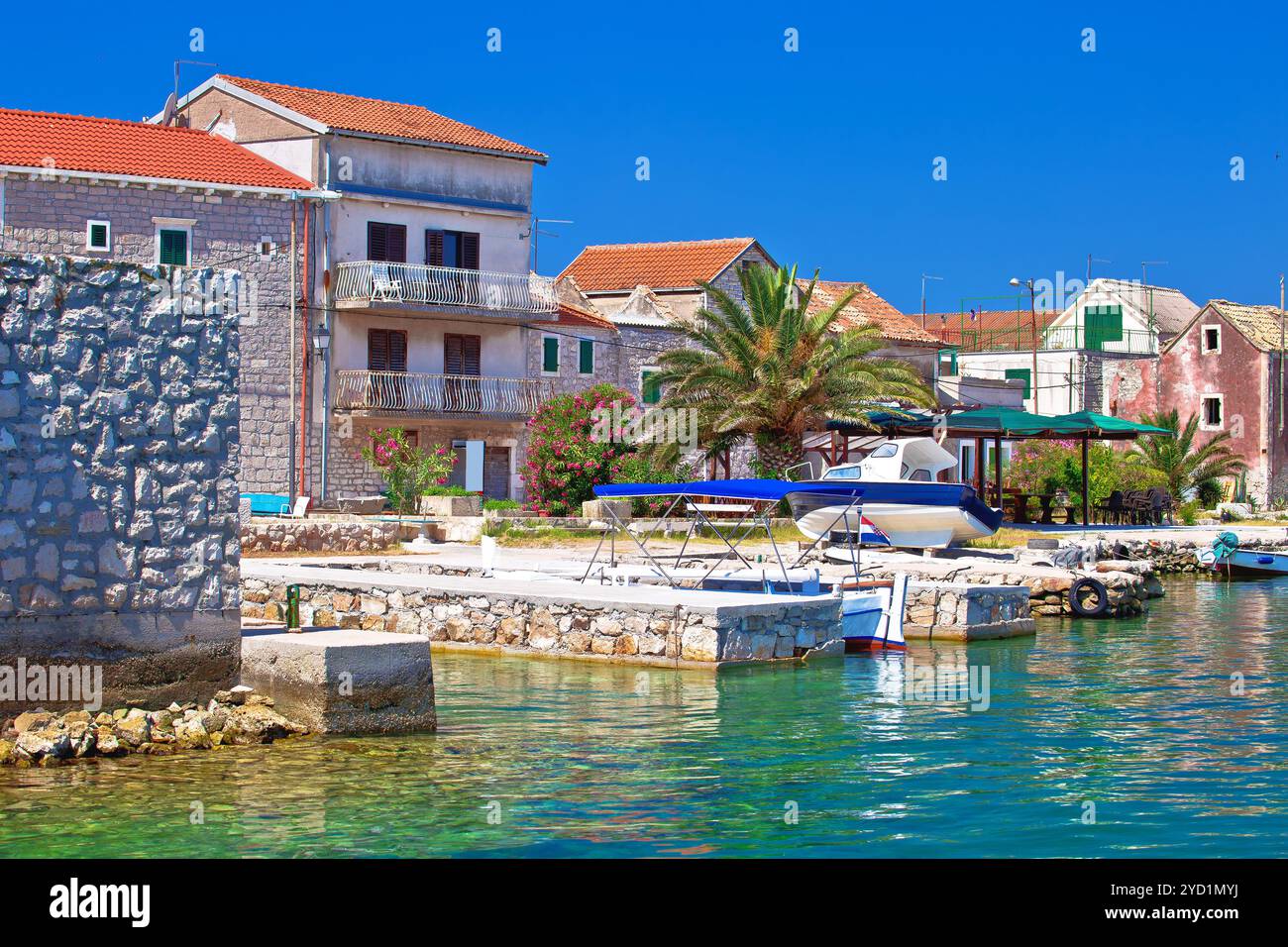 Colorful waterfront of Krapanj island village view Stock Photo - Alamy