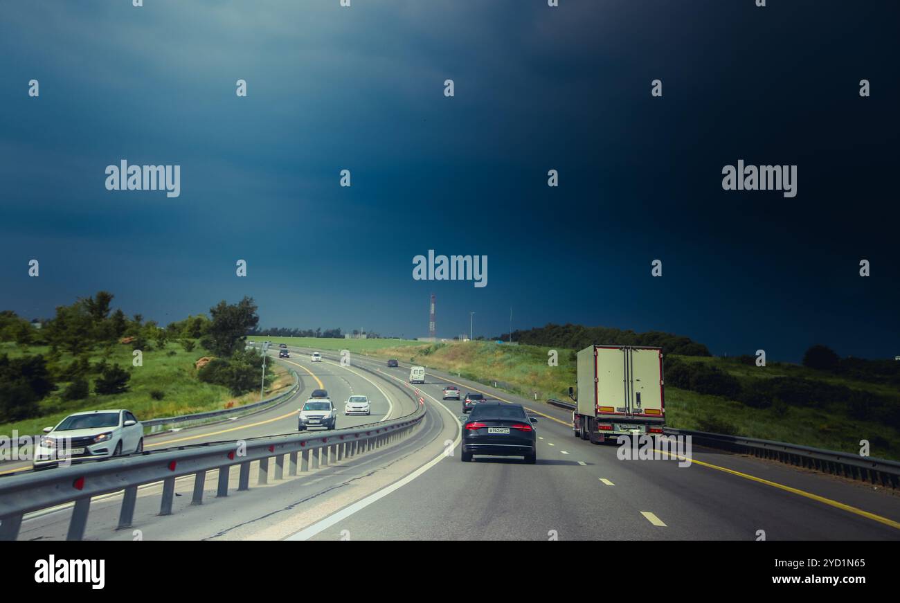 Russian asphalt roads. Highway. Road trip. The car goes on the road ...