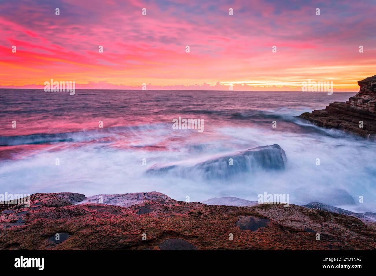 Blazing red sunrise over the Sydney east coast Stock Photo - Alamy