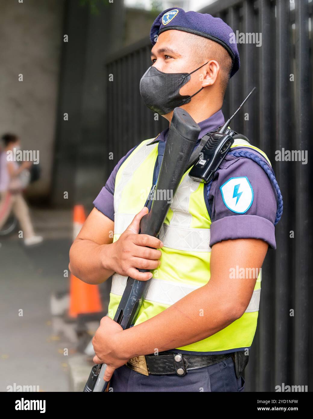 Manila-January 13 2023:Male security employee,wearing a facemask and ...