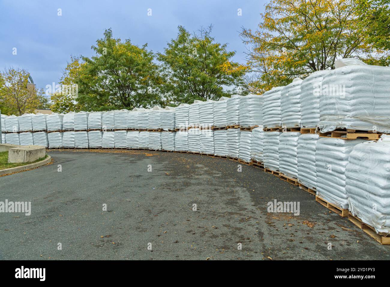 Many rows of inventory of bags of mulch at retail store outside ...