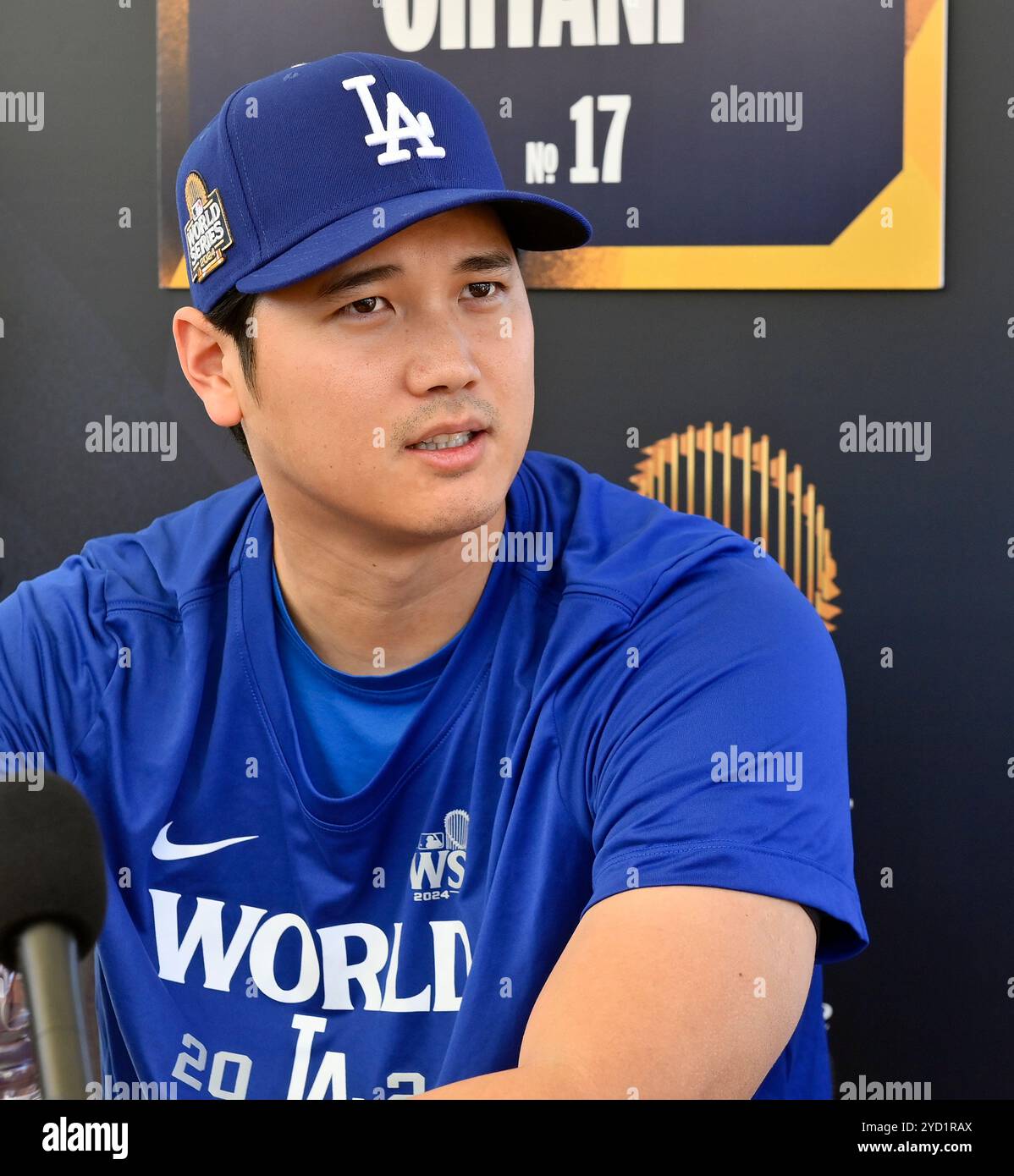 Los Angeles Dodgers designated hitter Shohei Ohtani speaks to the media ...