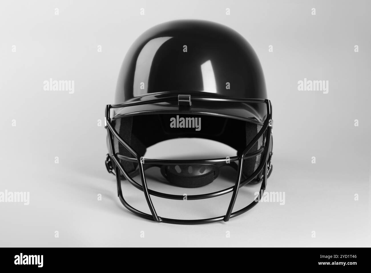 One black baseball helmet on white background Stock Photo - Alamy