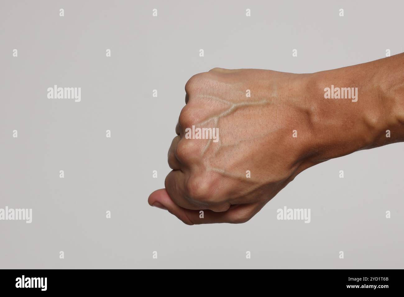 Man with bulging veins on his arm against light background, closeup ...