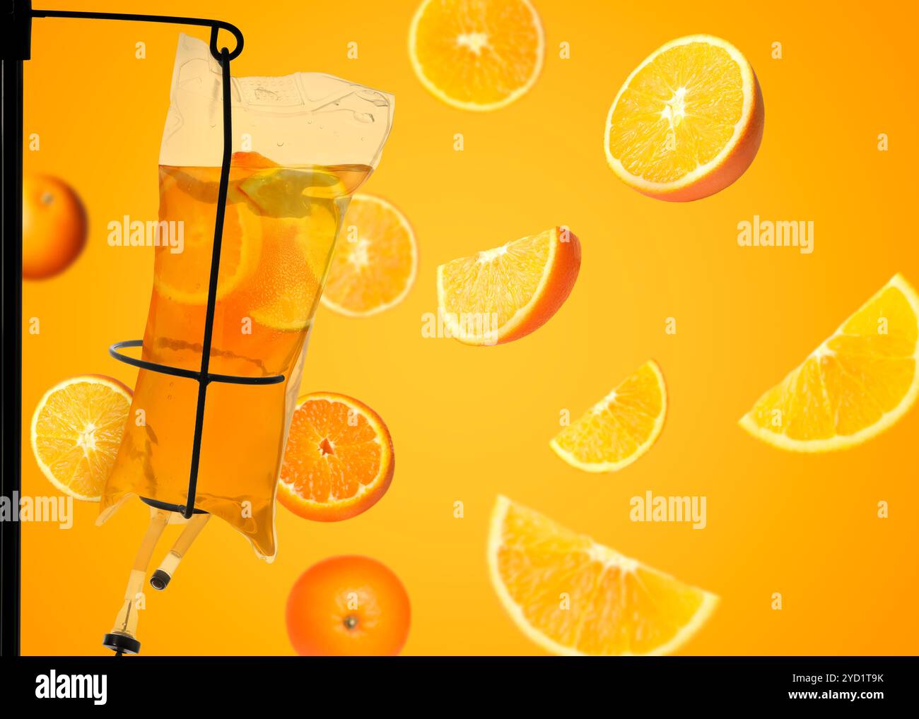 Vitamin intravenous therapy. IV infusion set and falling oranges on ...