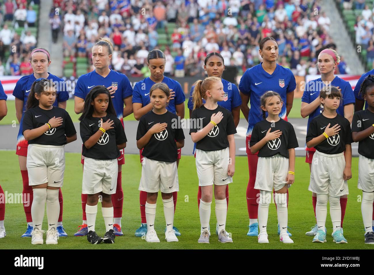 U.S. Women's National Team (USWNT) members listen to the National ...