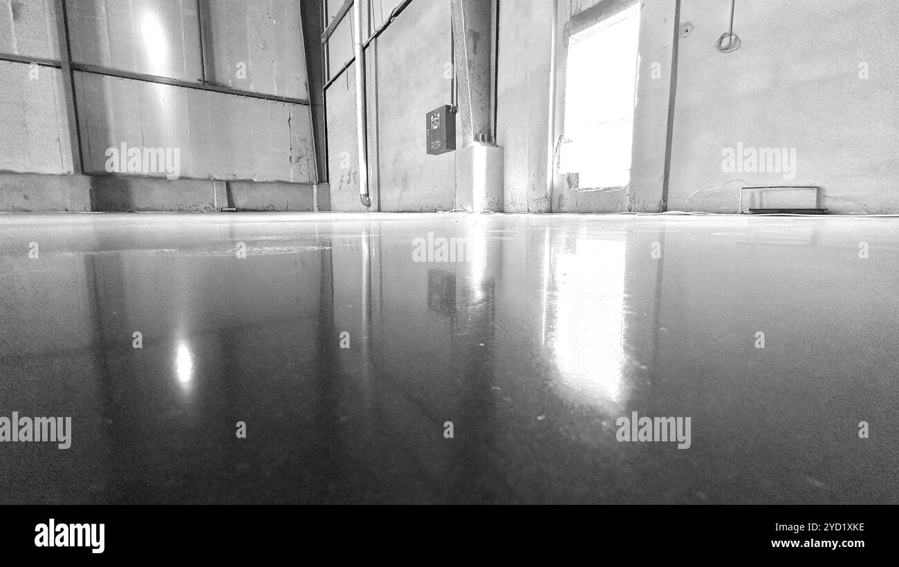 Empty industrial warehouse interior with concrete flooring Black and ...