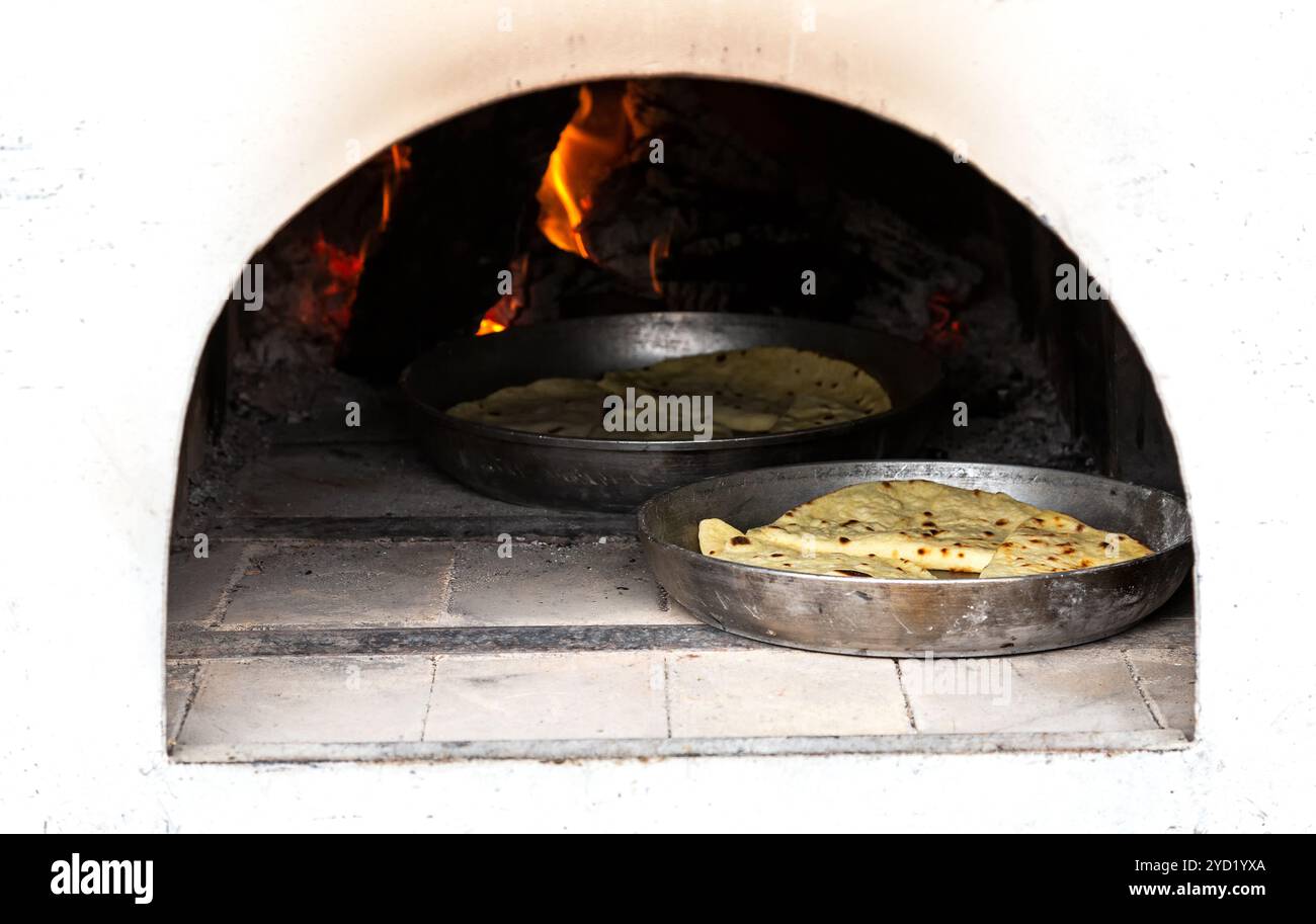 Cooking traditional pies in a Russian oven Stock Photo - Alamy