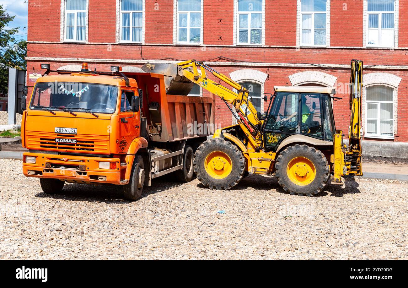 Front loader working on the construction of new road Stock Photo - Alamy