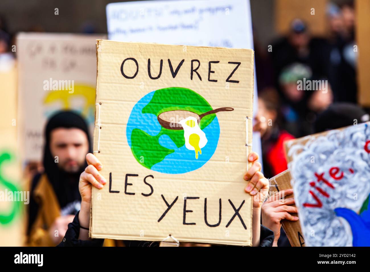 Environmentalist holds French sign Stock Photo - Alamy