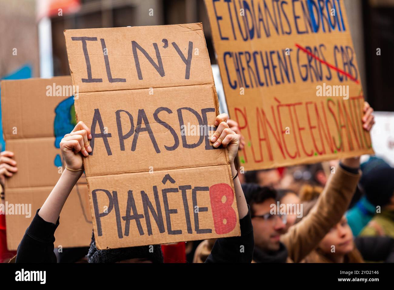 Climate activists hold signs hi-res stock photography and images - Alamy