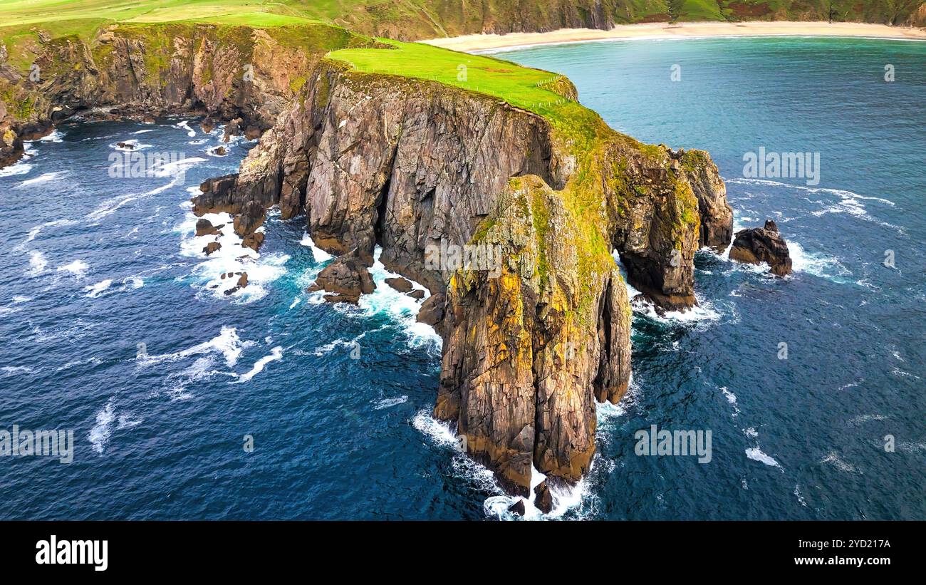 A Beautiful Coastal Landscape Featuring Rocks and Glimmering Water ...