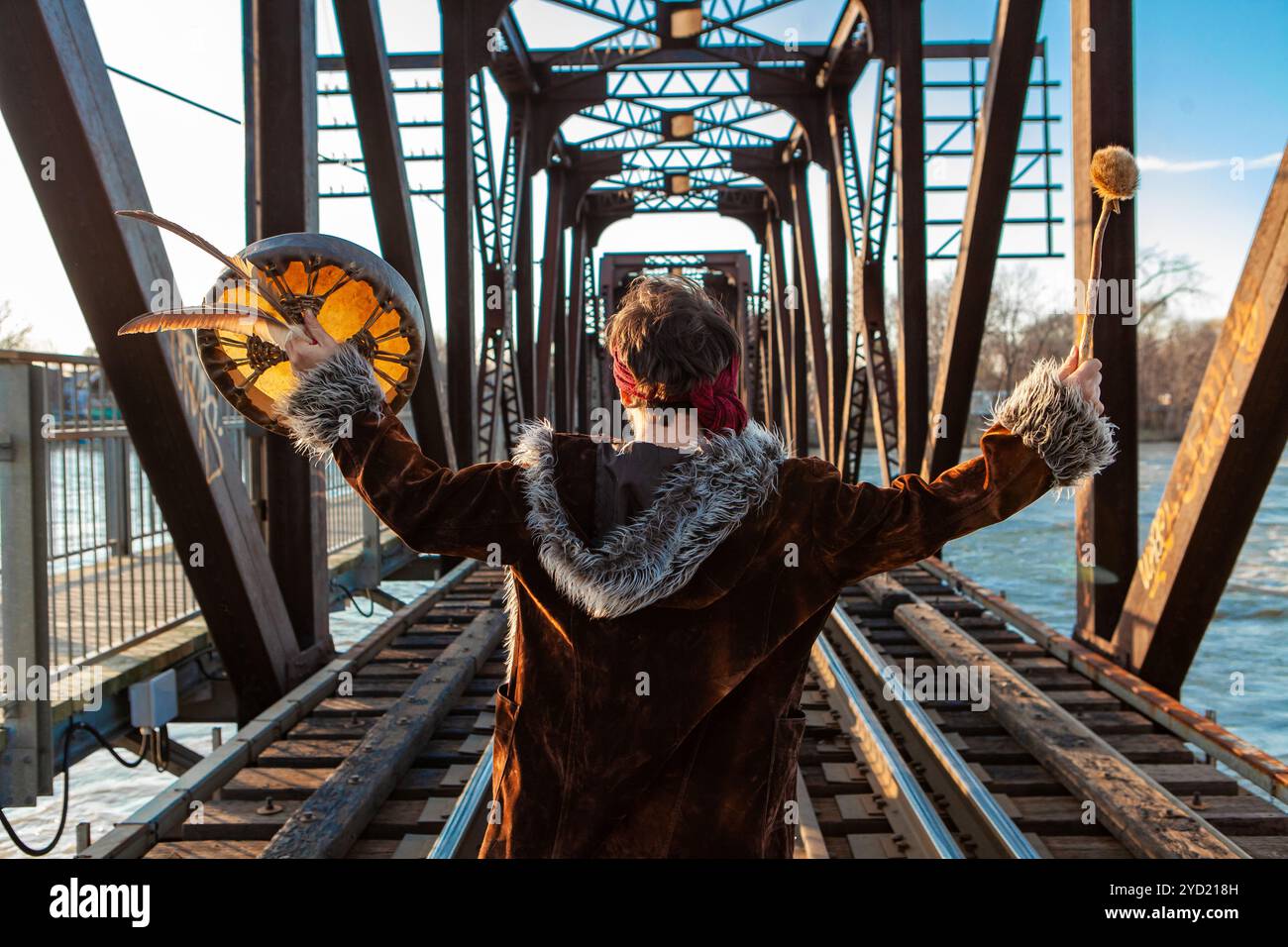 Sacred man views modern engineering Stock Photo - Alamy