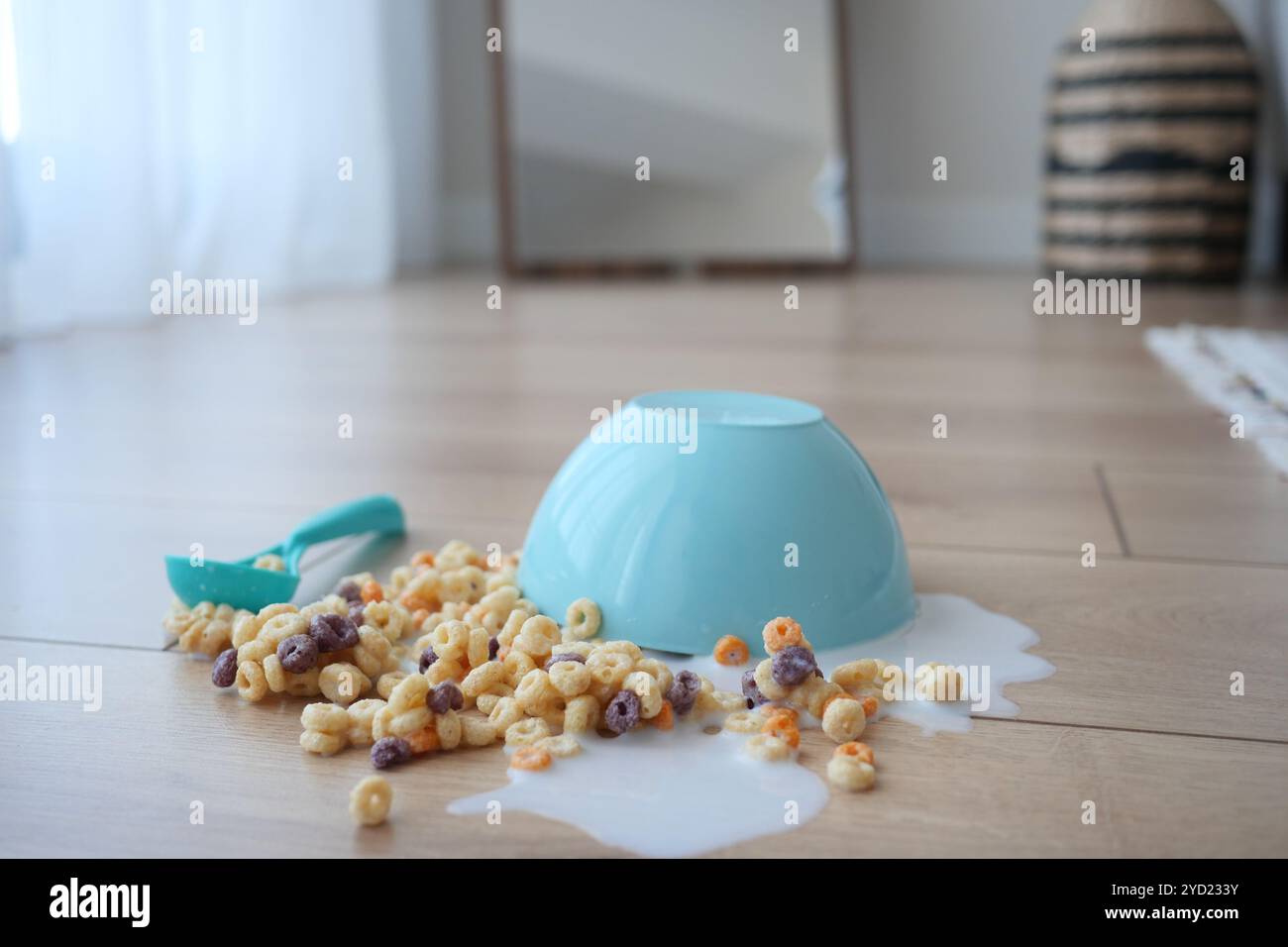 Spilled breakfast cereal on floor Stock Photo - Alamy