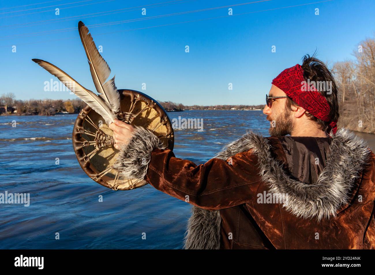 Spiritual man worships natural river Stock Photo - Alamy