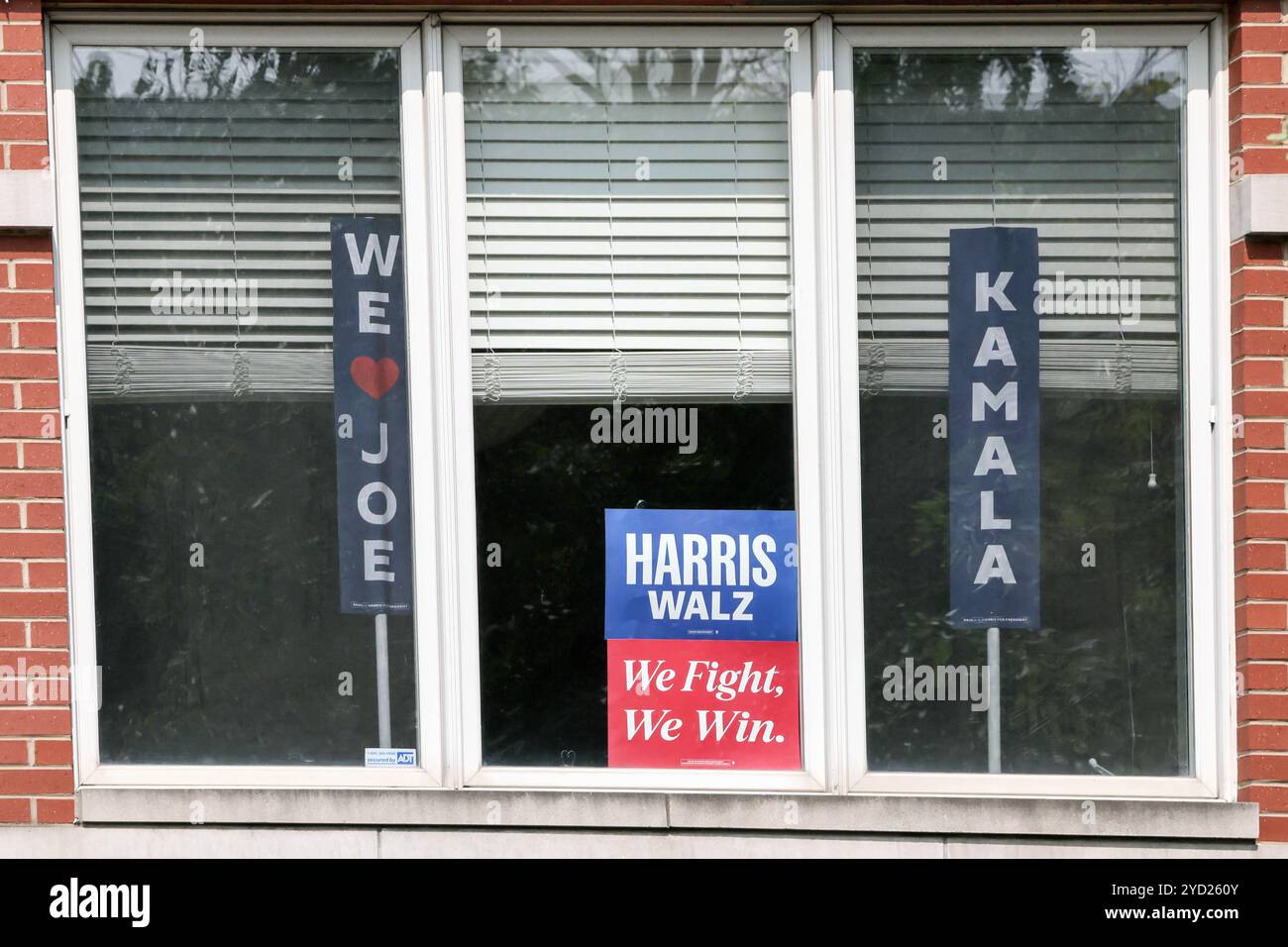 Harris Walz campaign signs are prominently seen from a window in ...
