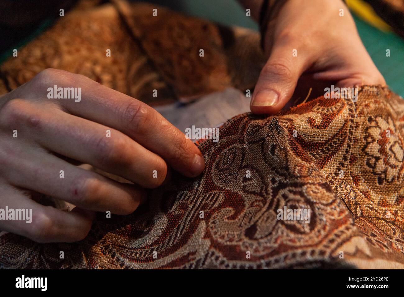 Adding needle points to a quilted fabric Stock Photo - Alamy