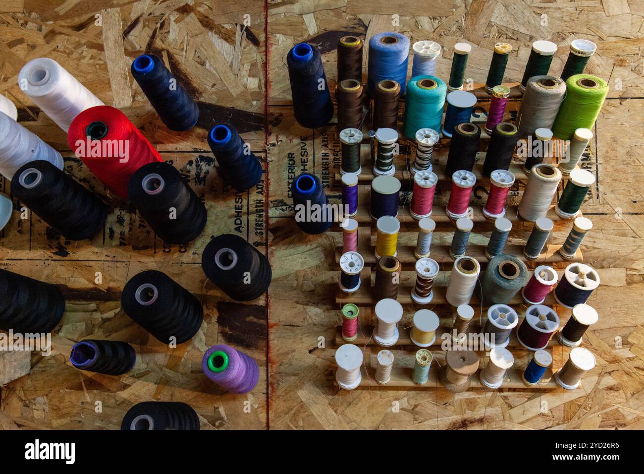 Color threads exposed on aspenite wall Stock Photo - Alamy