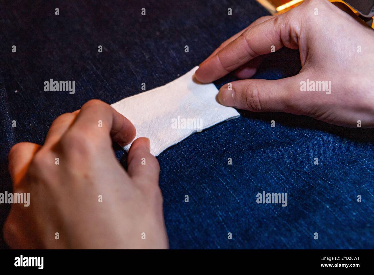 Sewing blue fabric on machine hi-res stock photography and images - Alamy