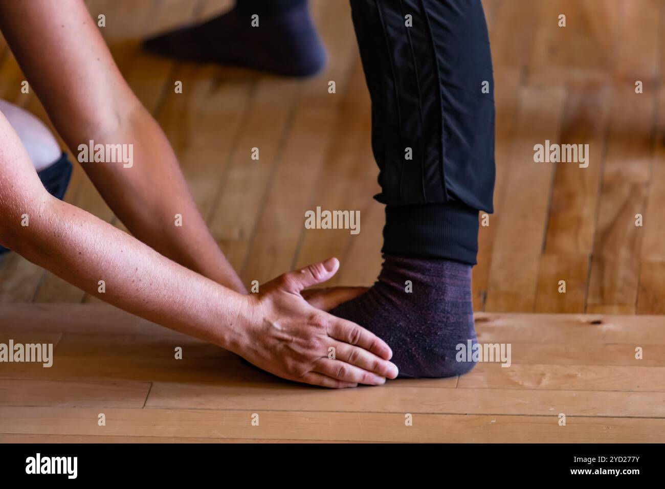 Person correcting the position of a foot Stock Photo - Alamy