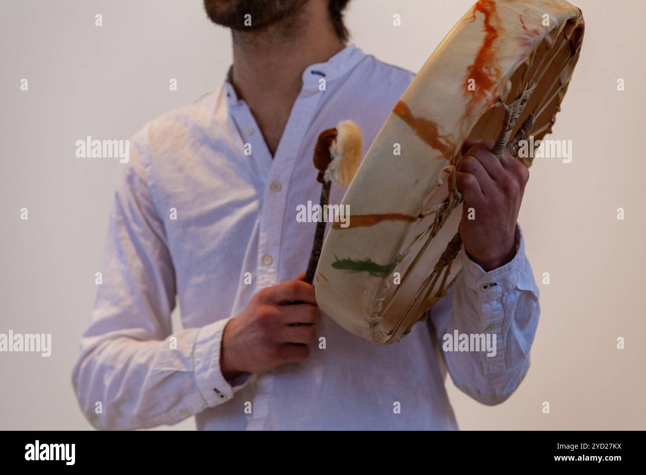 Man playing native american sacred drum Stock Photo - Alamy