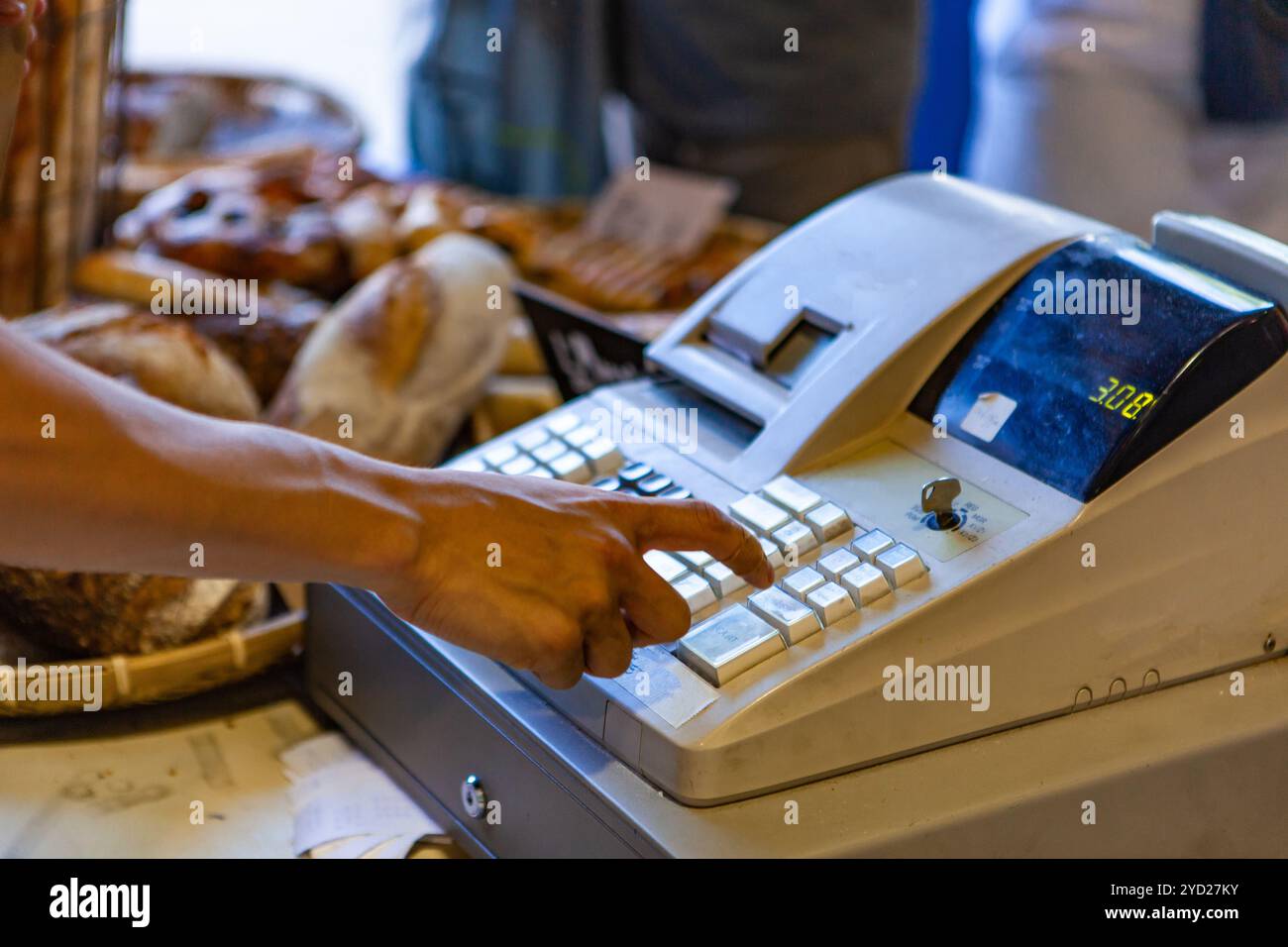 Operating an old school cashier Stock Photo - Alamy