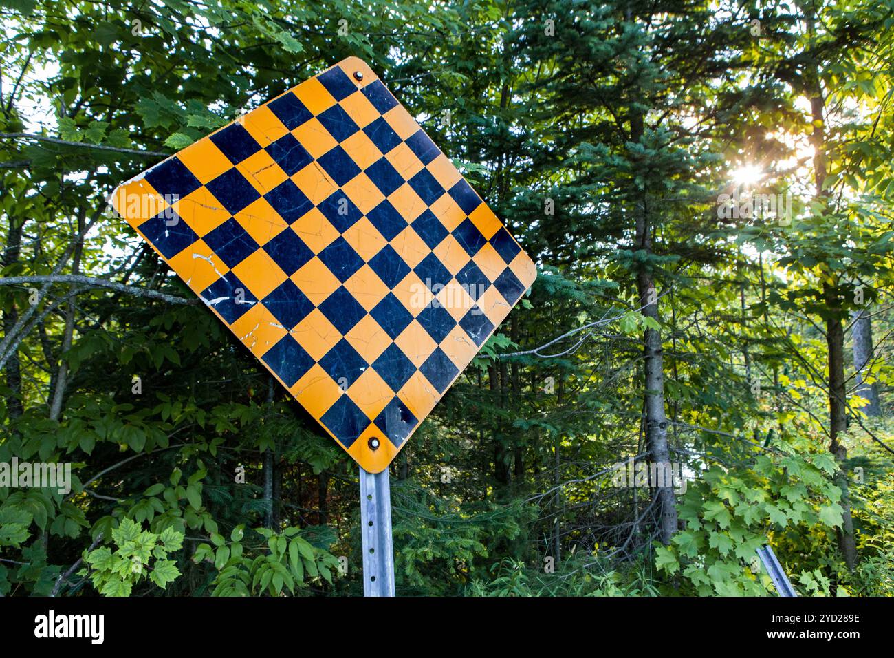 Orange and black warning sign placed in a dead-end Stock Photo - Alamy