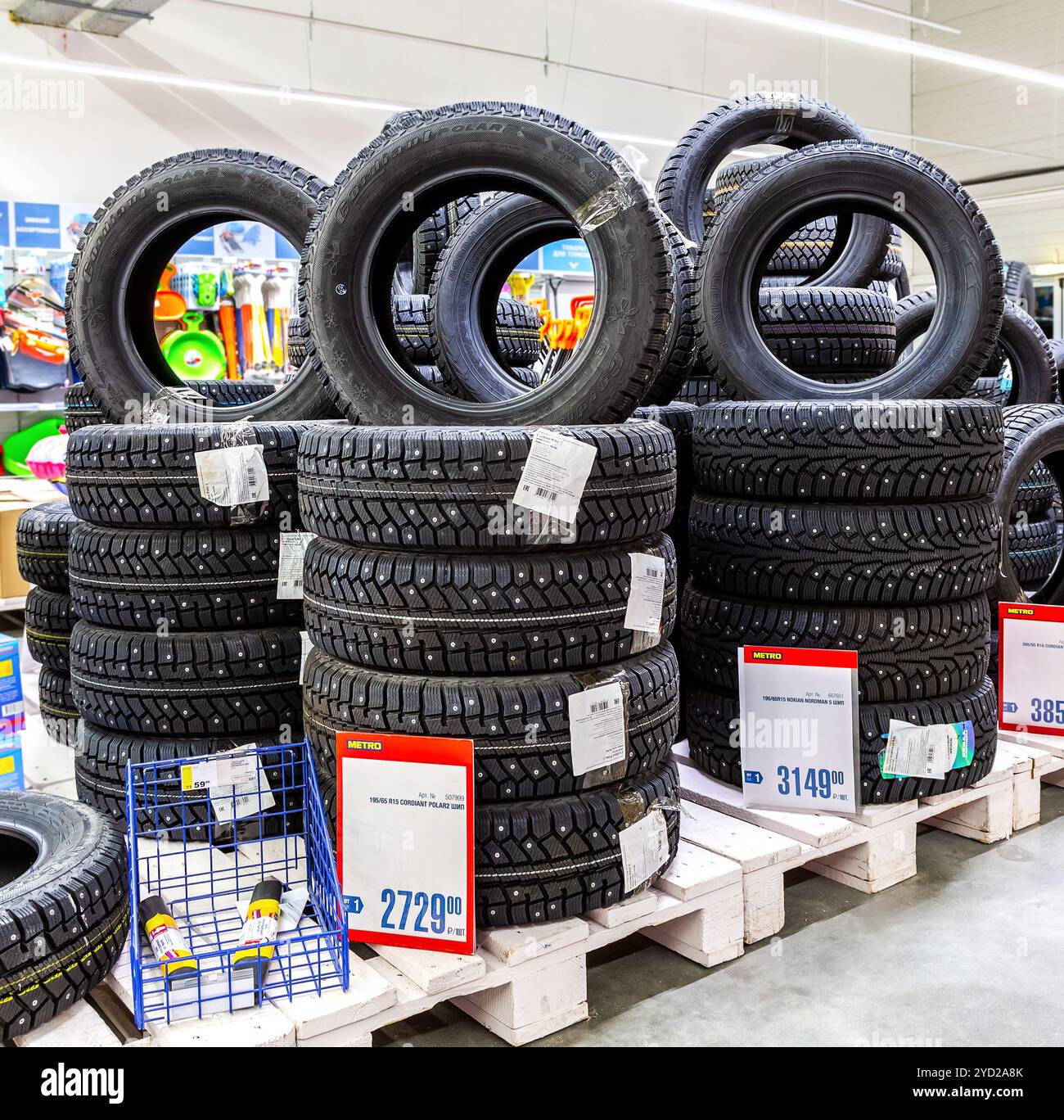 Winter vehicle tires stacked up for sale Stock Photo - Alamy