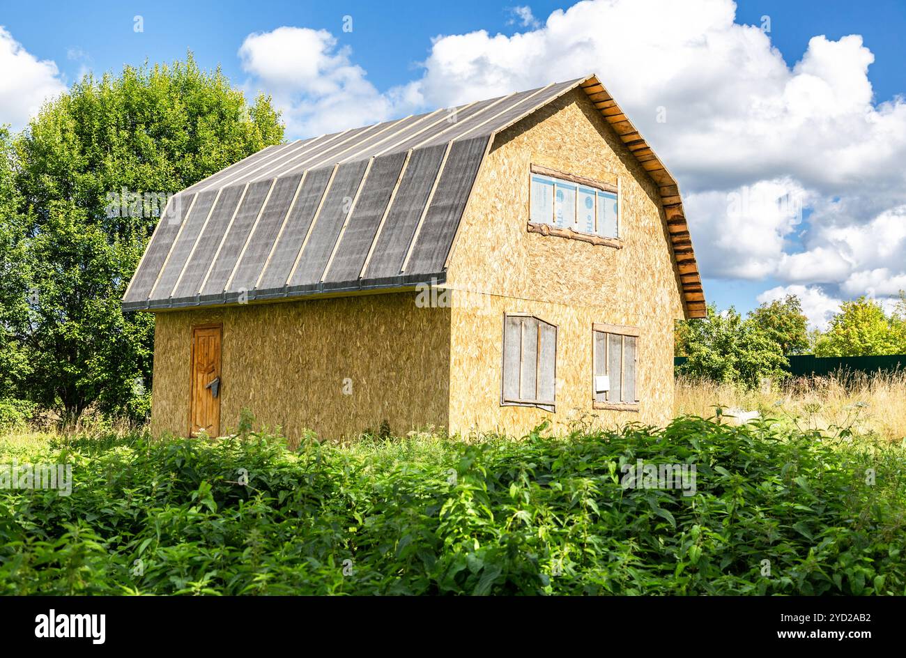 Construction of a new wooden house at the village Stock Photo - Alamy