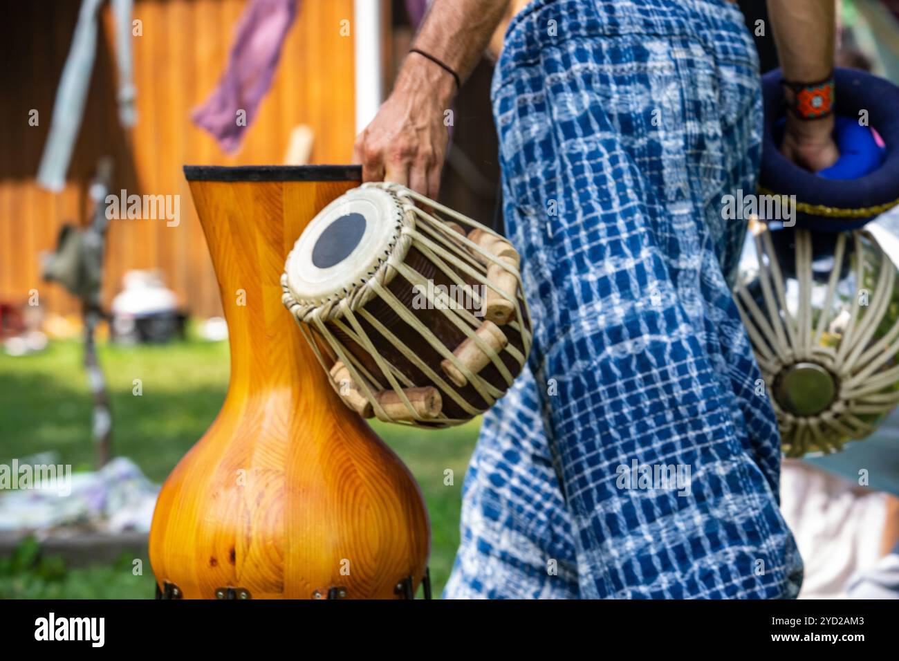 Spiritual man holding music instruments Stock Photo - Alamy
