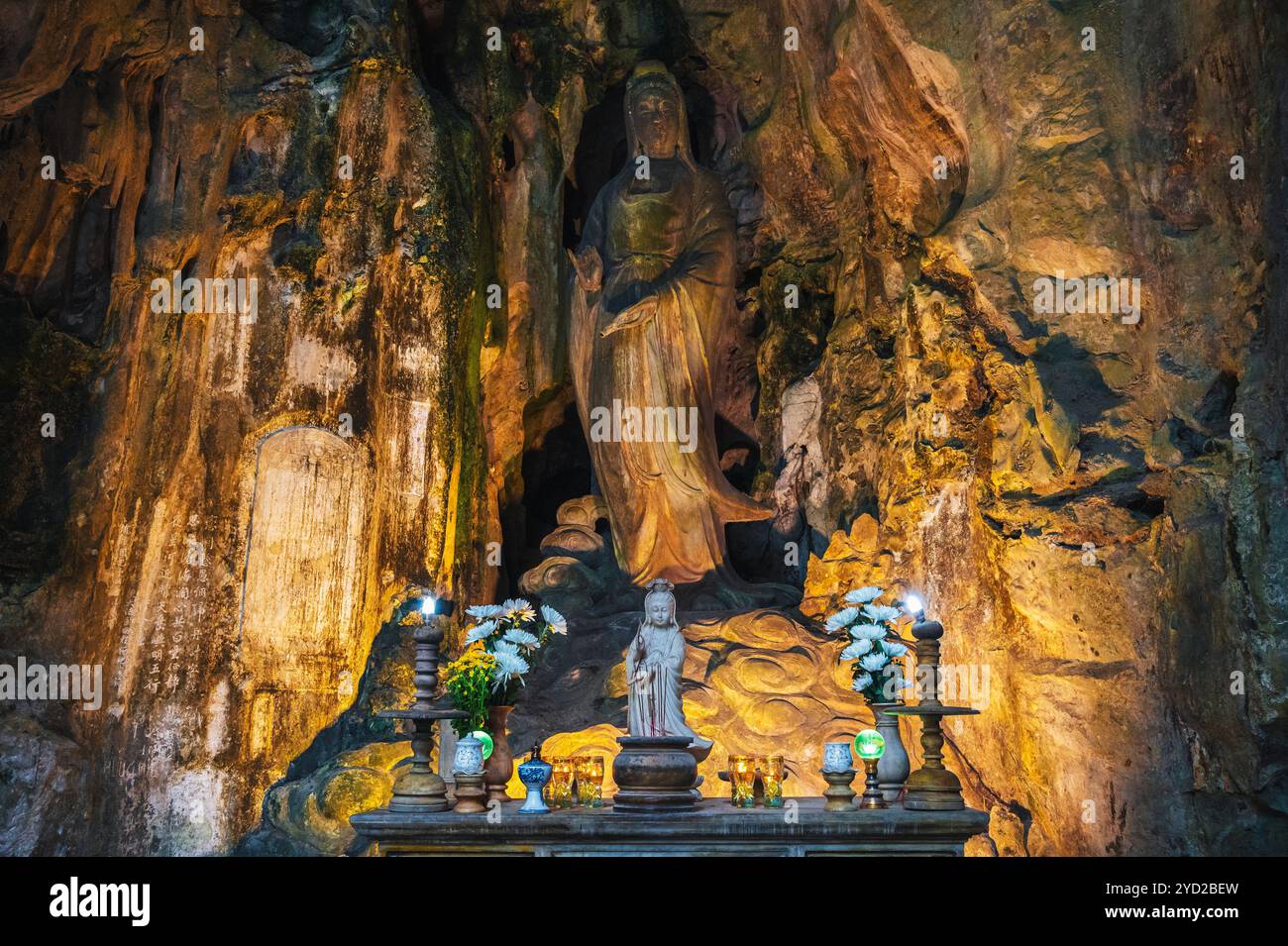 Buddhist temple with statues and a sanctuary inside the Tong Chon Cave ...