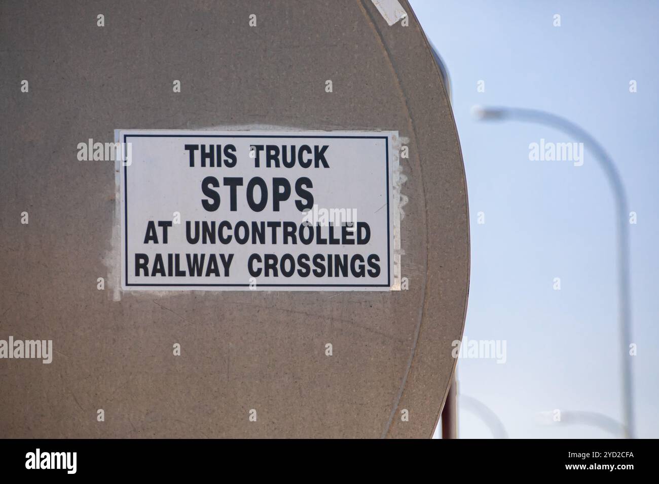 Warning signs on metal tank truck back Stock Photo - Alamy