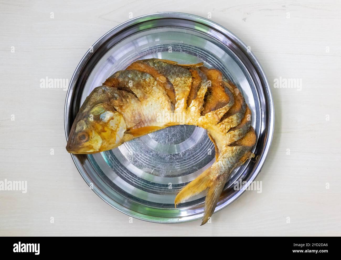 Salted Hilsa fish on a steel plate. It is very delicious and popular ...