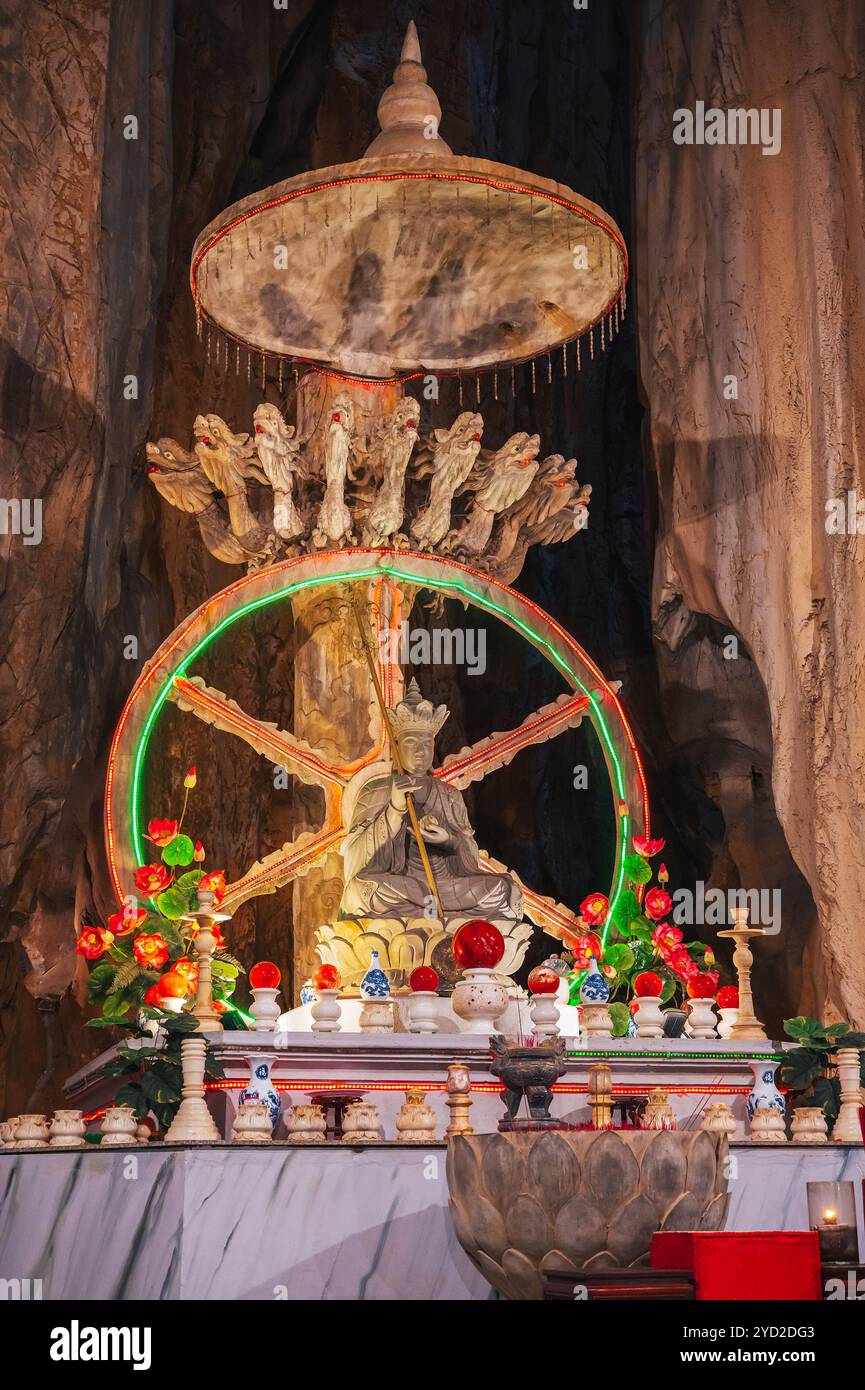 Buddhist Buddha statue and altar inside Asian temple in the Am Phu Cave ...