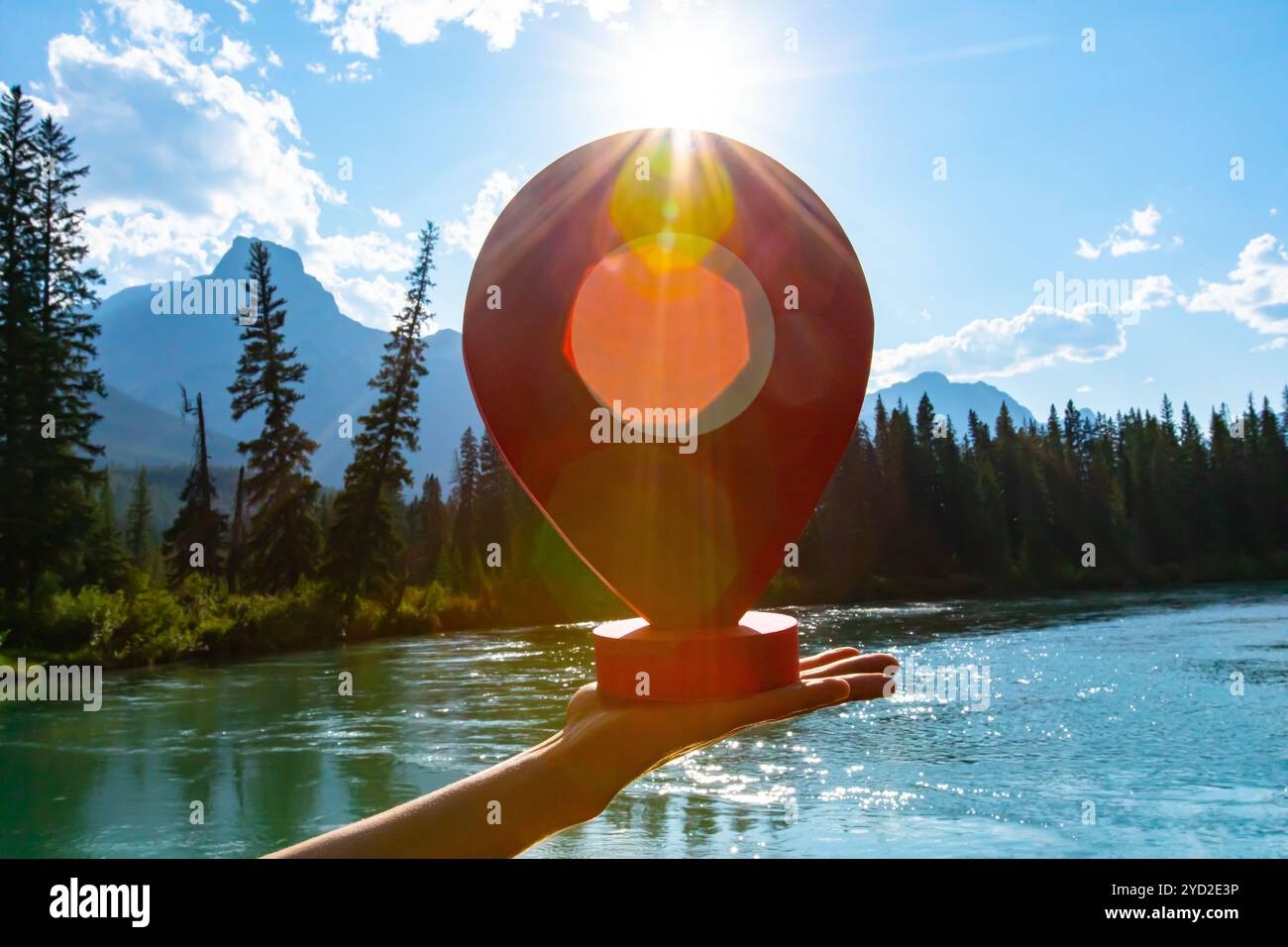 A bright lens flare from the summer sun covers a destination waypoint ...