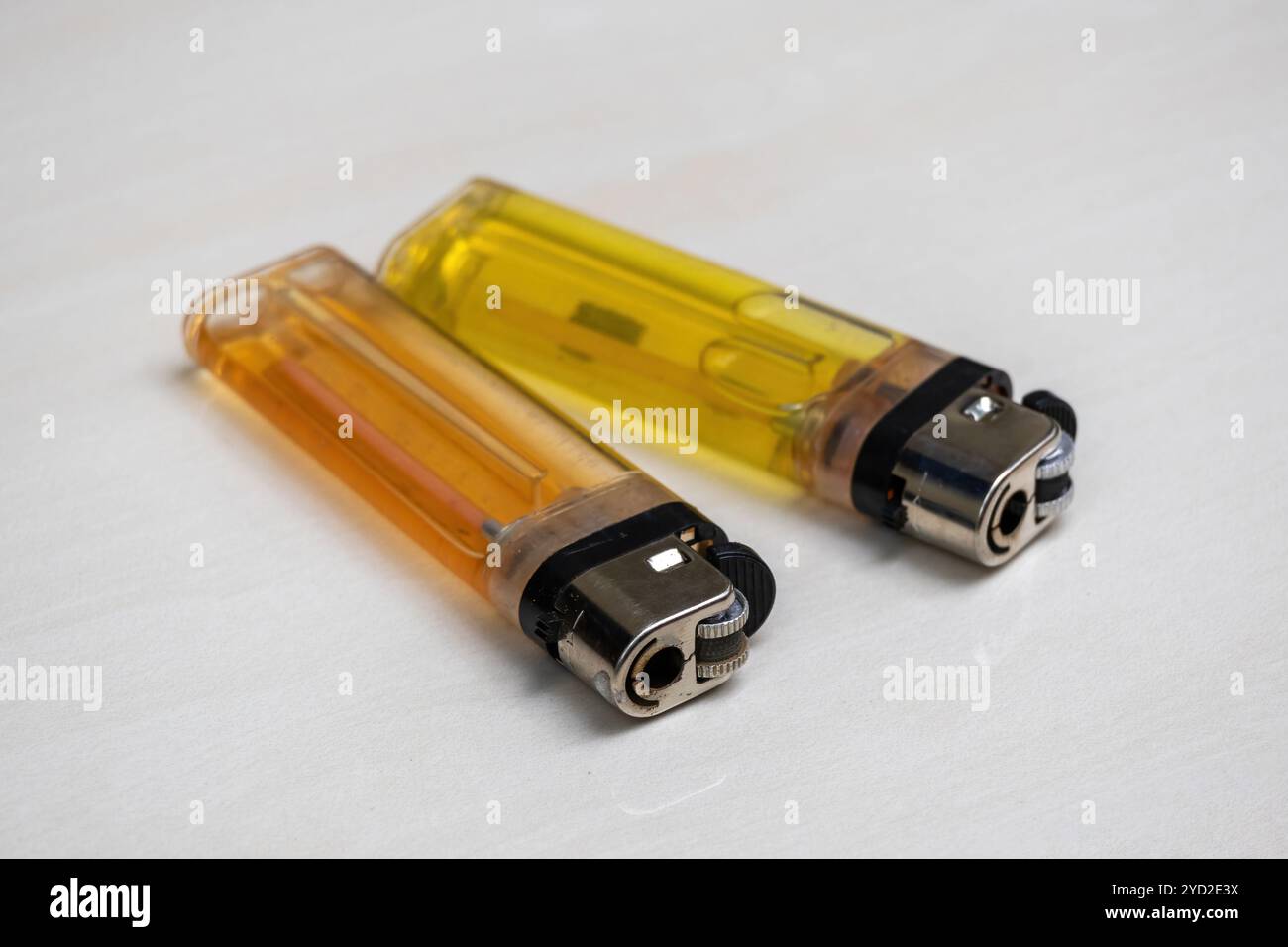 Two gas lighters, filled with gas. Portable tools to light the fire ...