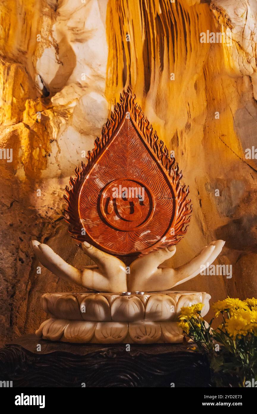 Buddhist statue inside Asian sacred temple in the Am Phu Cave in the ...