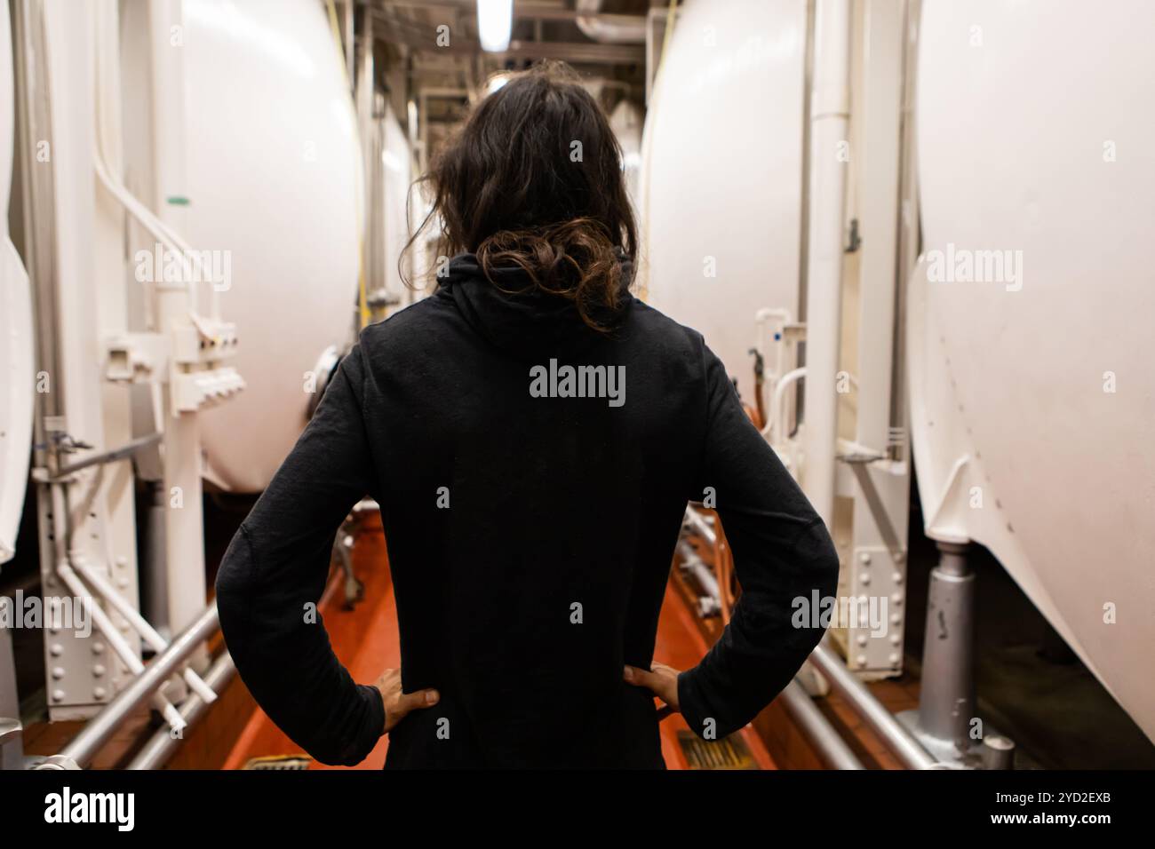 Man rear view between serving vessels Stock Photo - Alamy