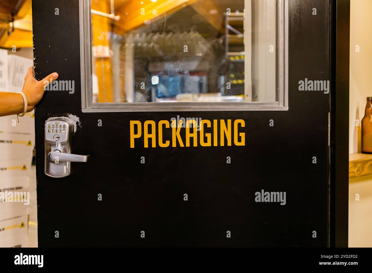 Packaging vinyl sticker text door sign Stock Photo - Alamy