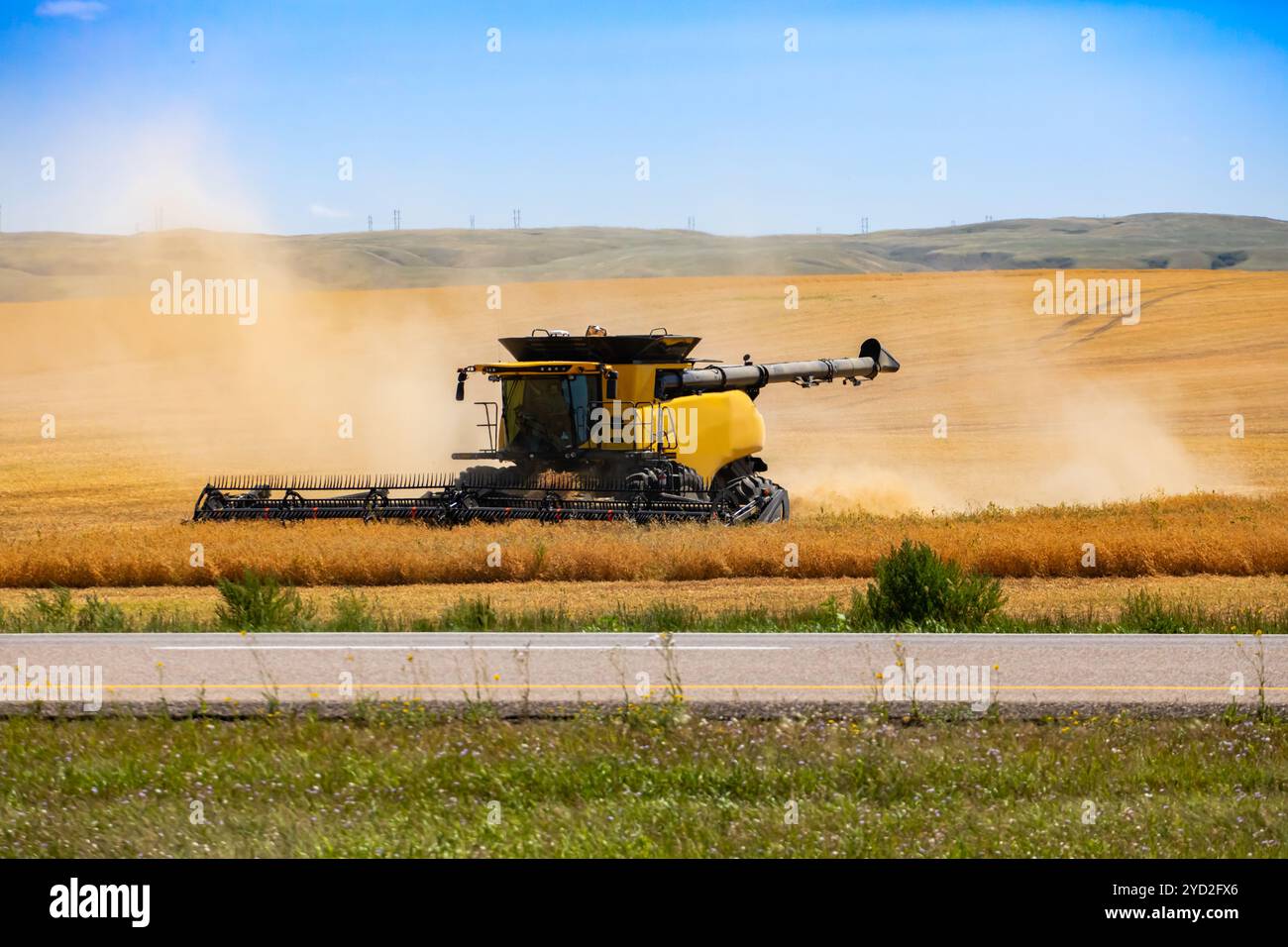 Combine harvester at work in crop field Stock Photo - Alamy