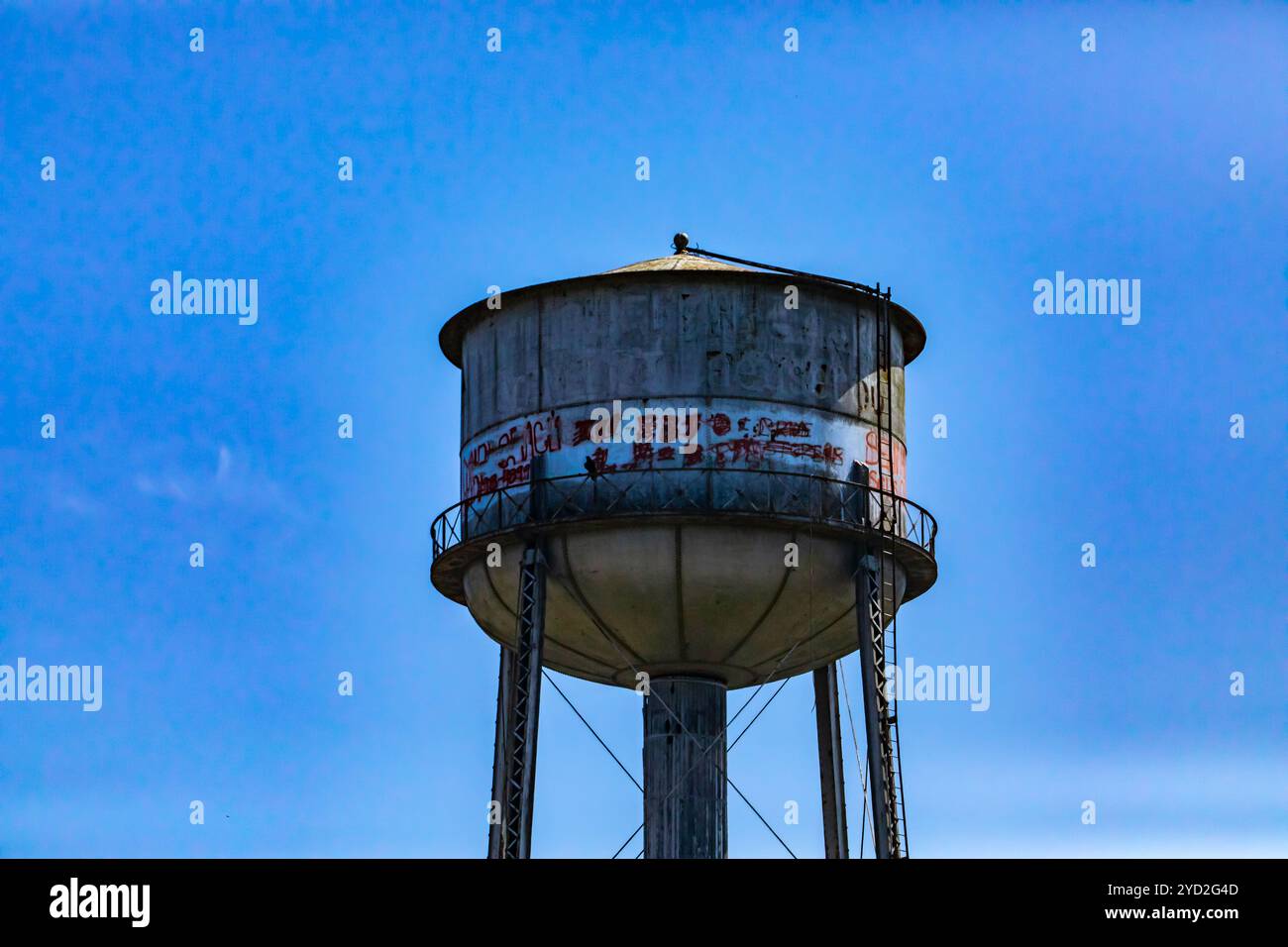 Retro water storage tower with blue sky Stock Photo - Alamy