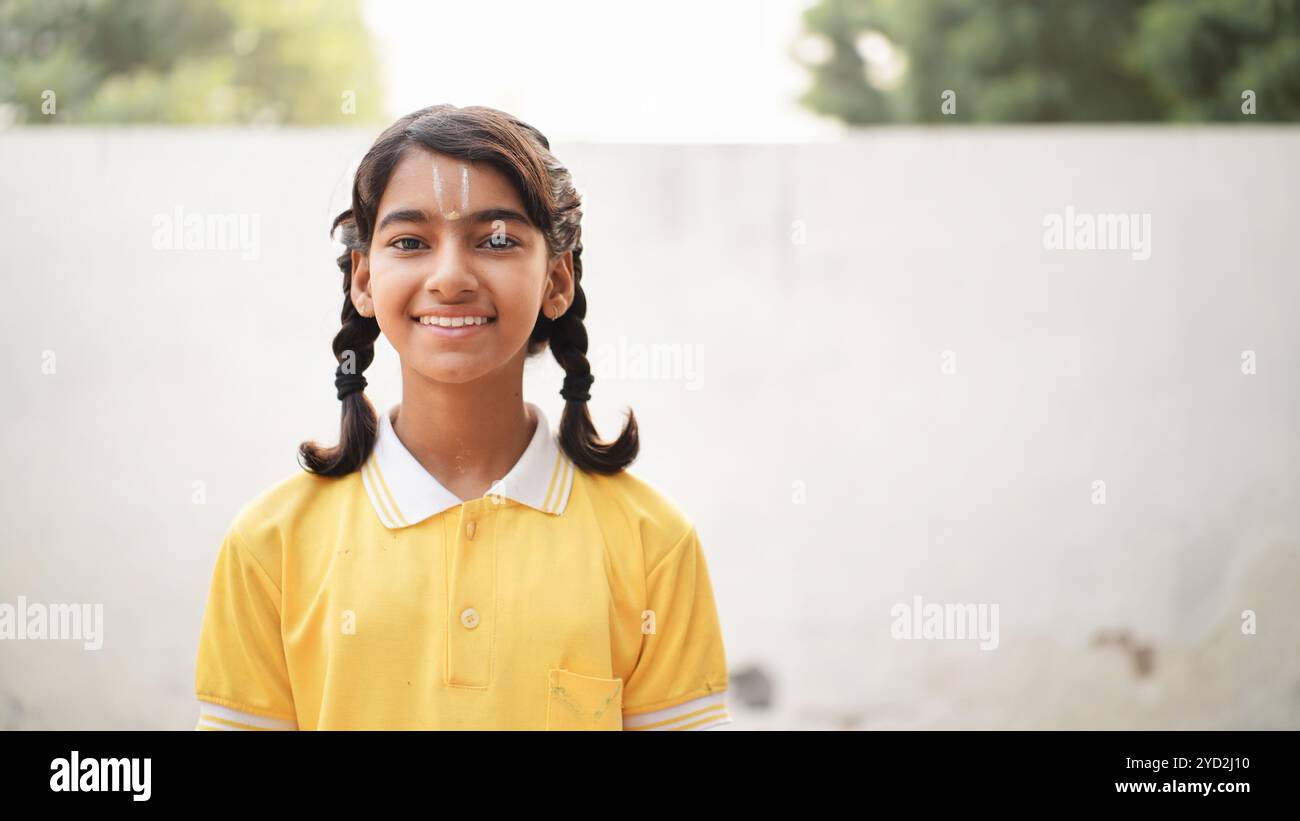 Happy Indian elementary school girls students sitting at desk in ...