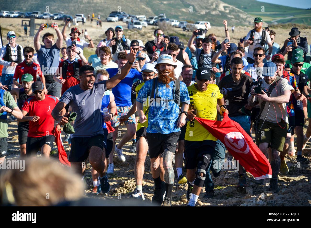 Cape Angela, Tunisia. 07 April 2024. Russ Cook runs with his supporters ...