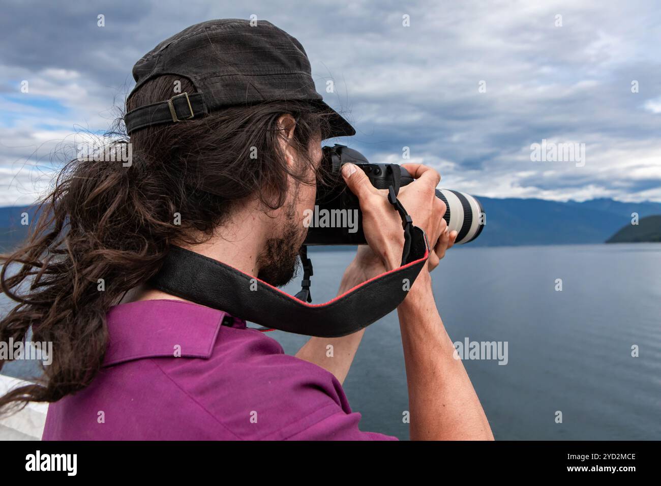 Photographer shooting landscapes on a ferry Stock Photo - Alamy