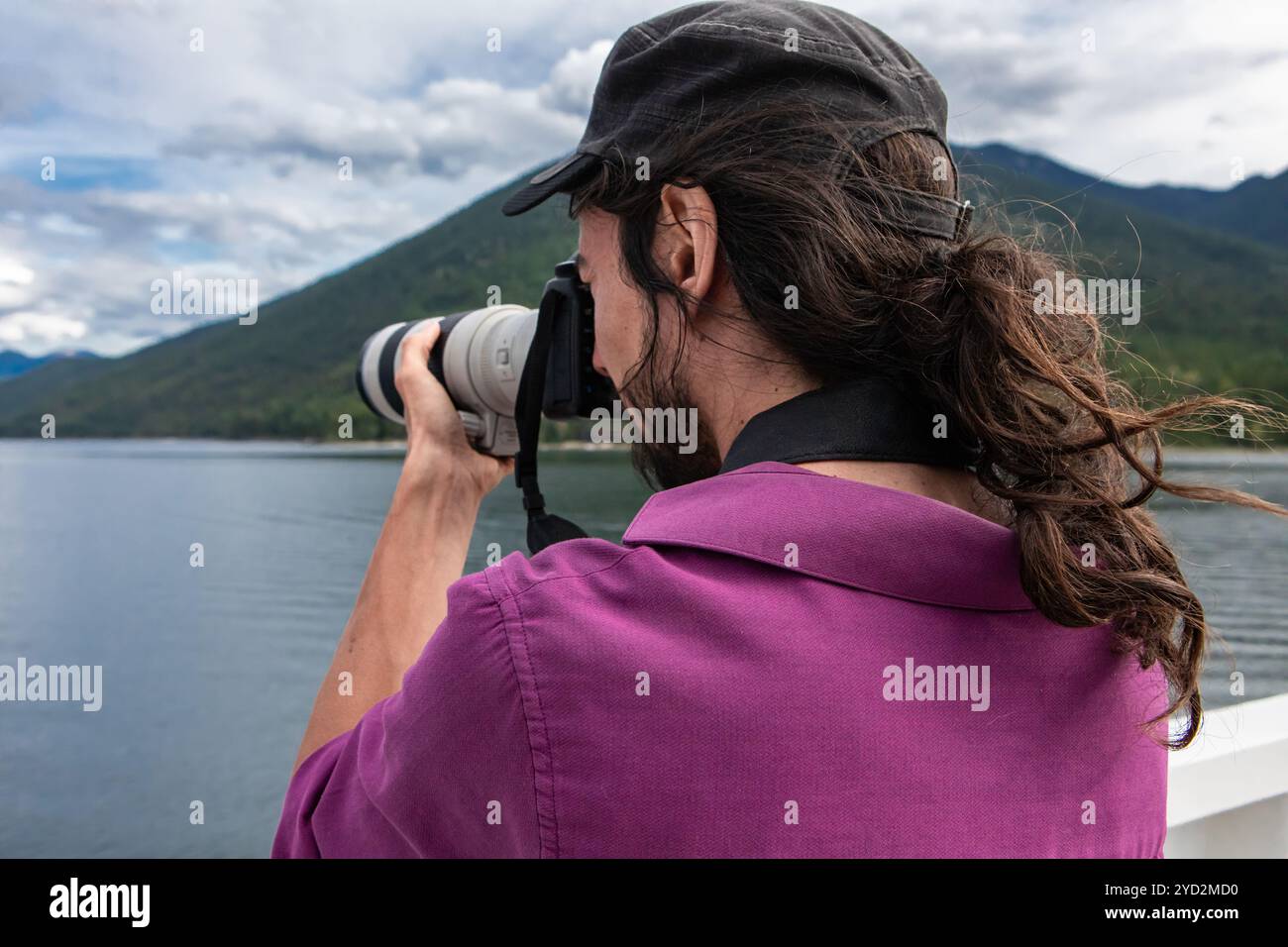 Photographer shooting landscapes on a ferry Stock Photo - Alamy
