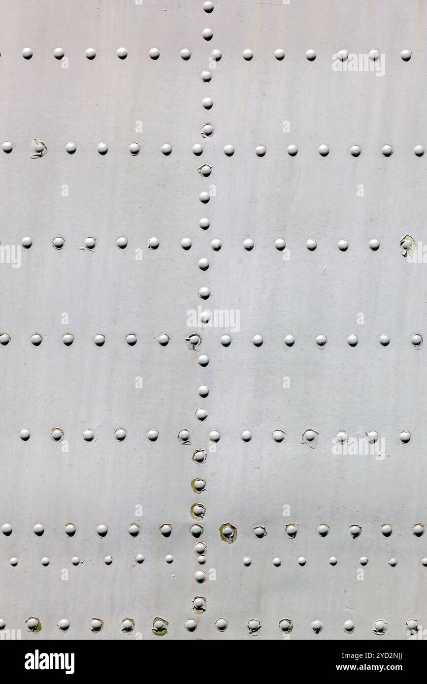 Metal surface with rivets as background Stock Photo - Alamy