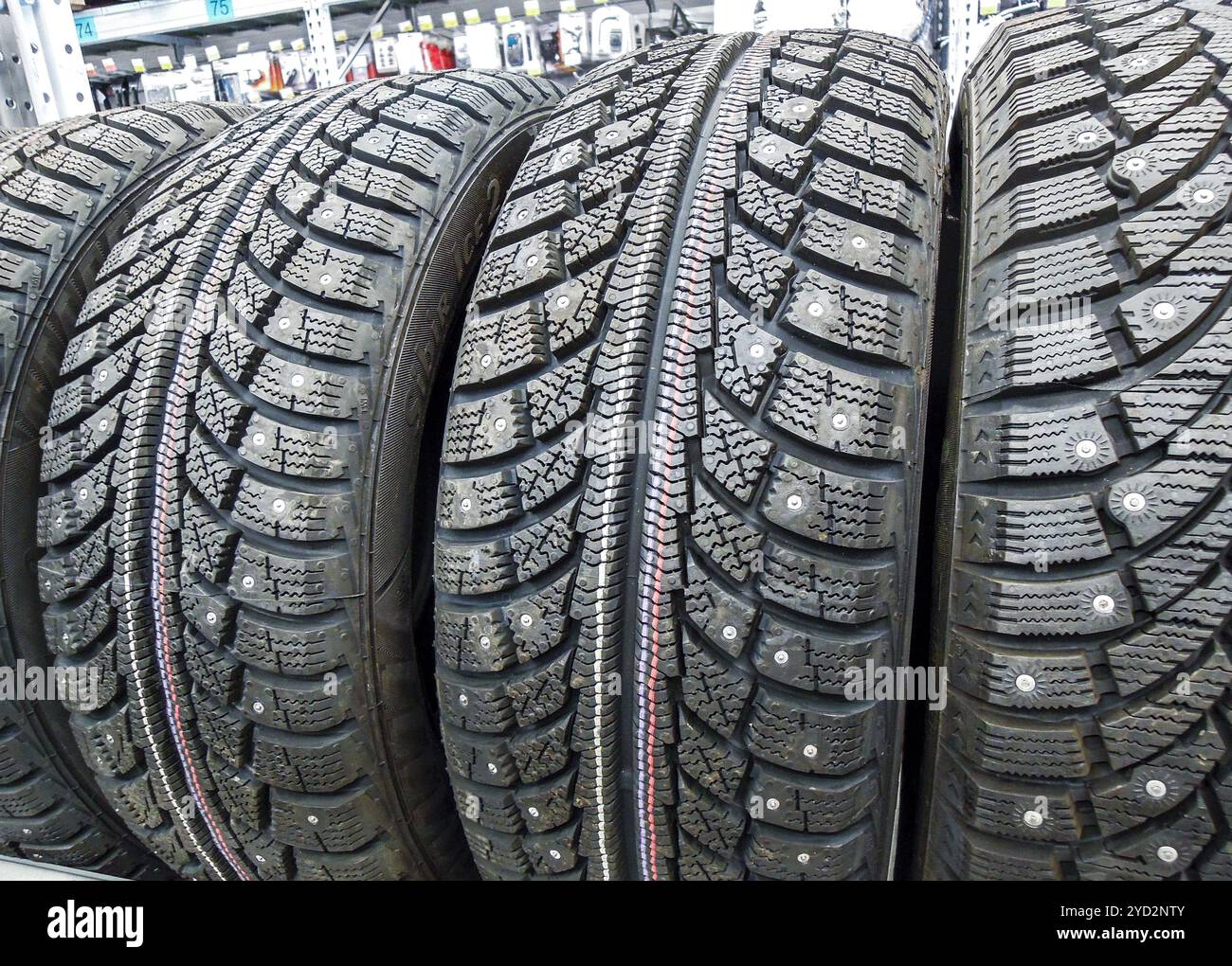 Winter vehicle tires stacked up for sale Stock Photo - Alamy